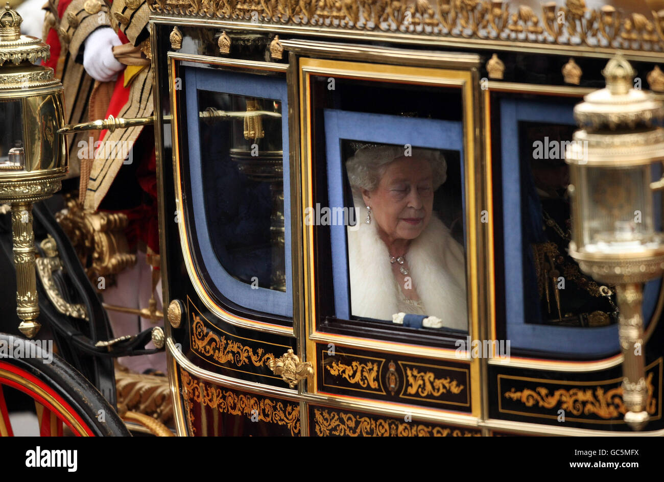 The State Coach carrying Britain's Queen Elizabeth II and the Duke of ...