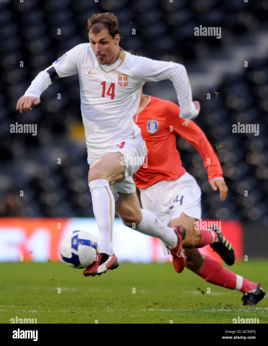 Serbia's Milan Jovanovic (left) and South Korea's Kim Do Heon battle ...