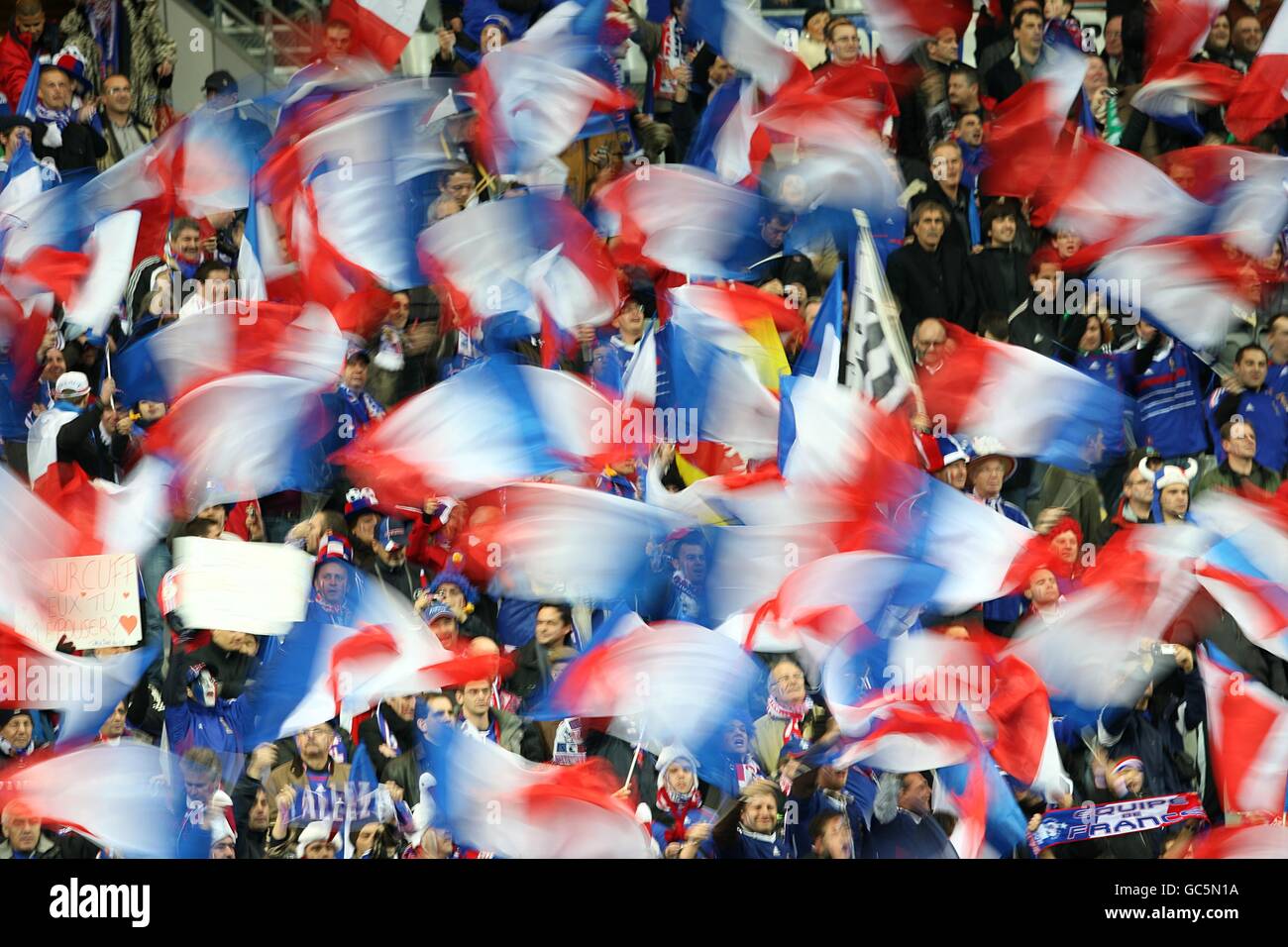 French fans wave flags in stands hi-res stock photography and images ...