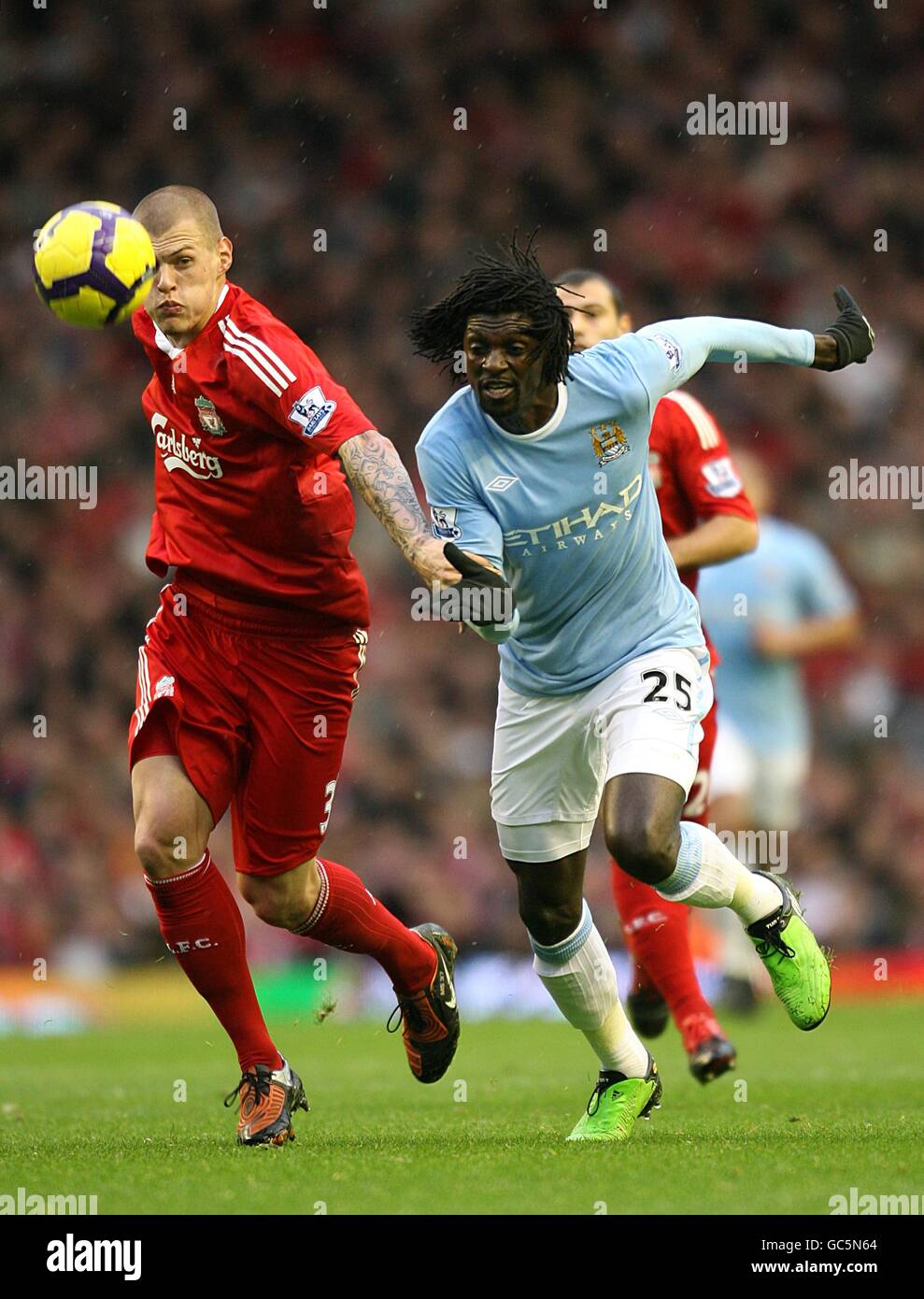 Manchester City's Emmanuel Adebayor (right) and Liverpool's Martin ...