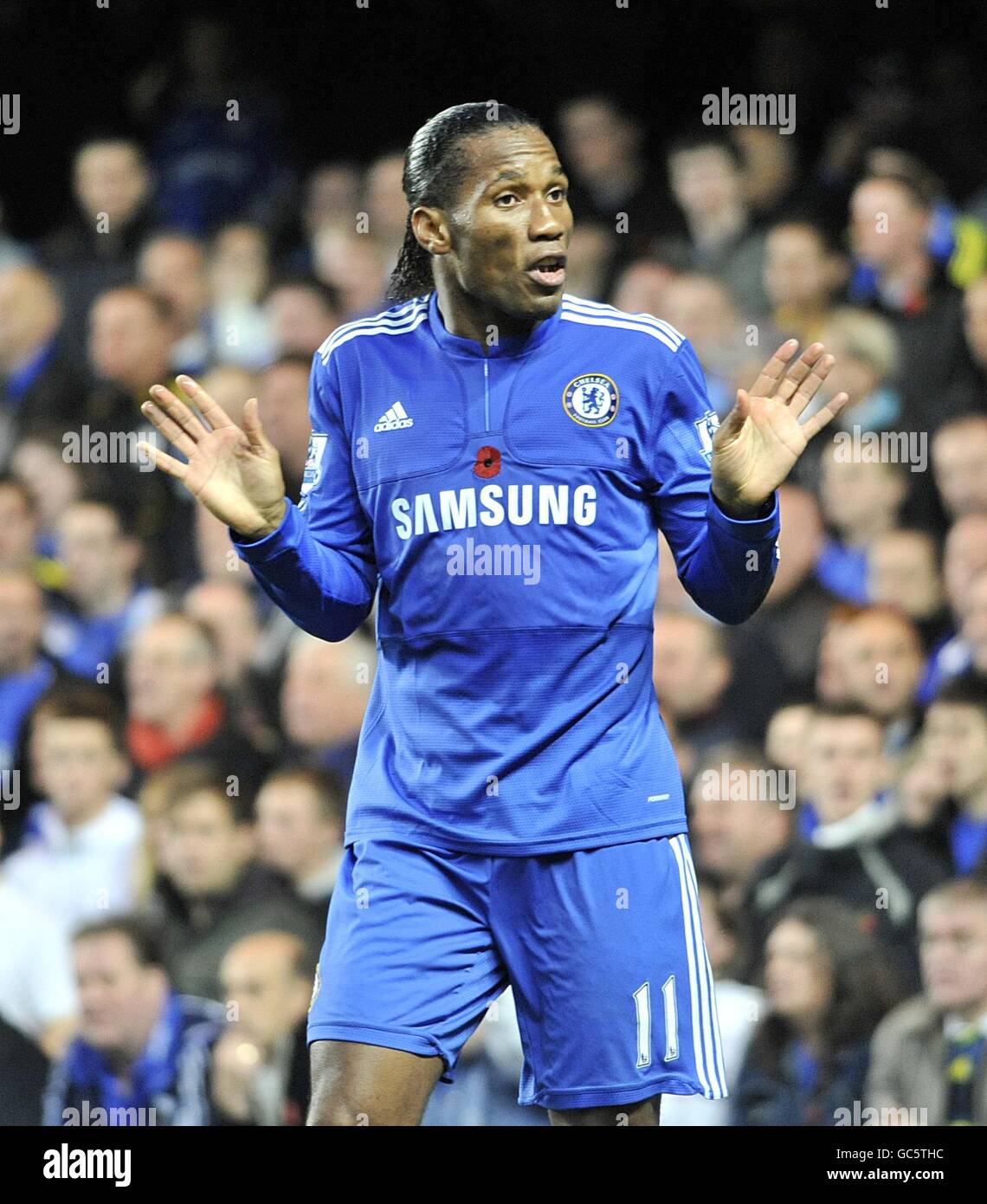 Chelseas didier drogba protests his innocence to the referees assistant ...
