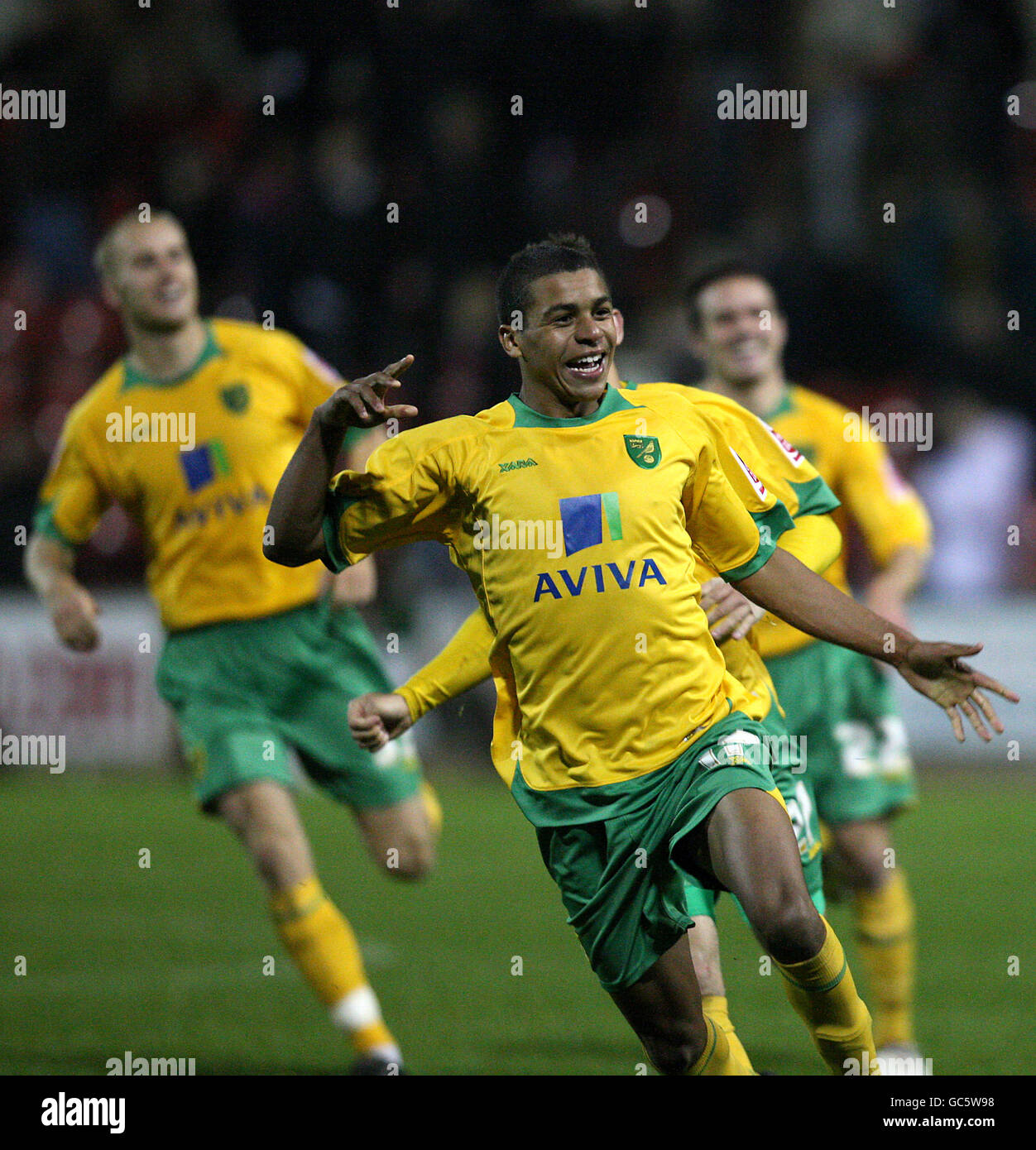 Norwich City's Tom Adeyemi and team mates rush to congratulate Jamie ...