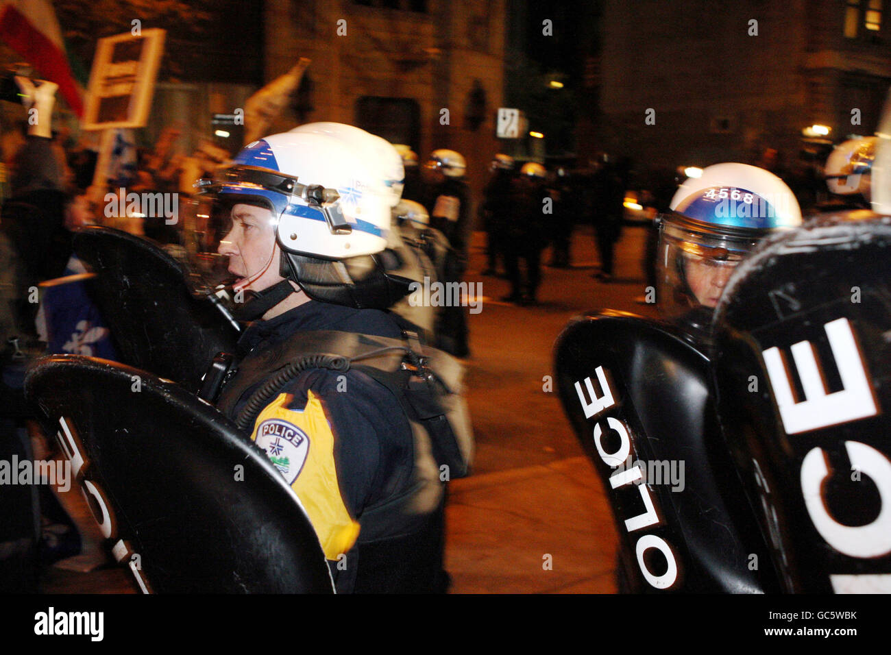 Riot police and anti-monarchy protesters clash outside the The Black ...