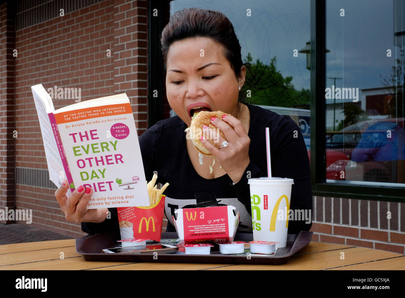 Female reading large book hi-res stock photography and images - Alamy