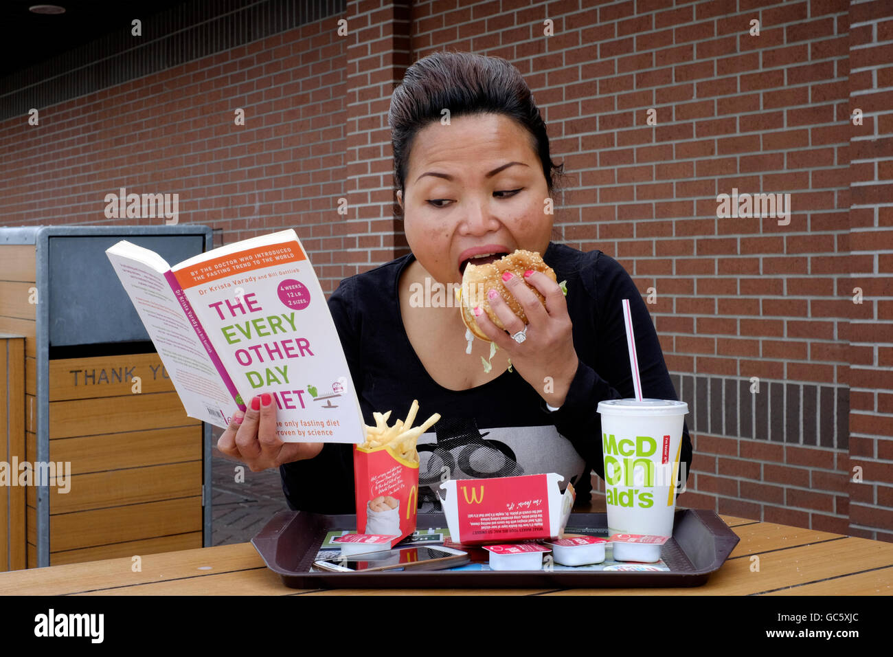 Female reading large book hi-res stock photography and images - Alamy