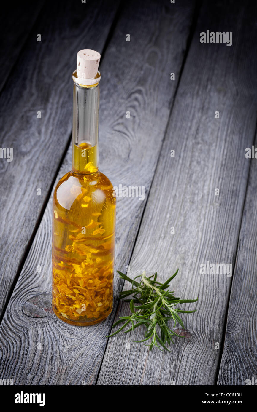 Homemade DIY natural infused olive oil with lemon peel Stock Photo - Alamy