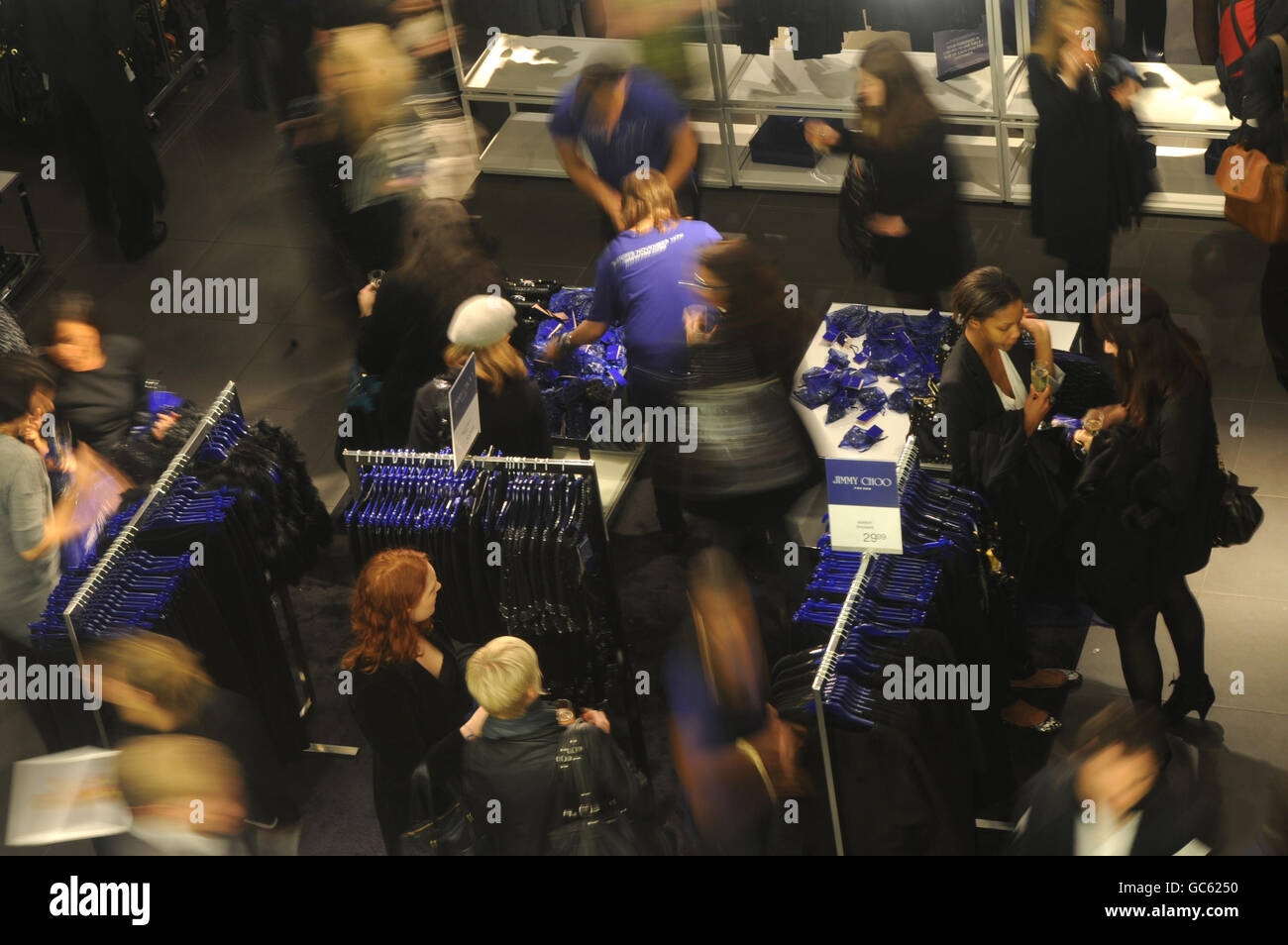 Shoppers snap up clothes and shoes during the Jimmy Choo for H&M launch ...
