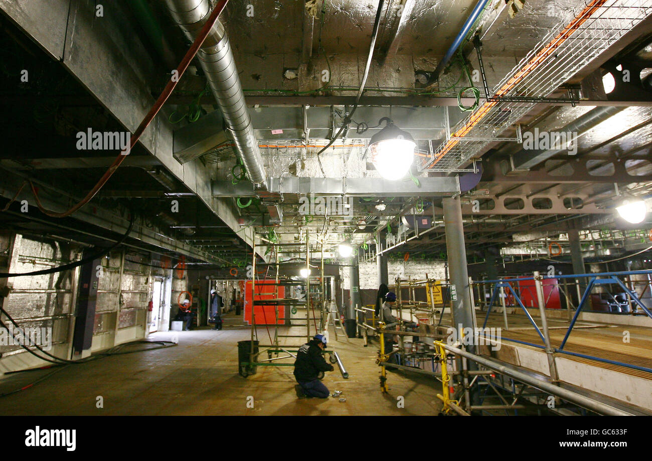 A shipyard worker at work inside the Cunard Queen Elizabeth cruise ship ...