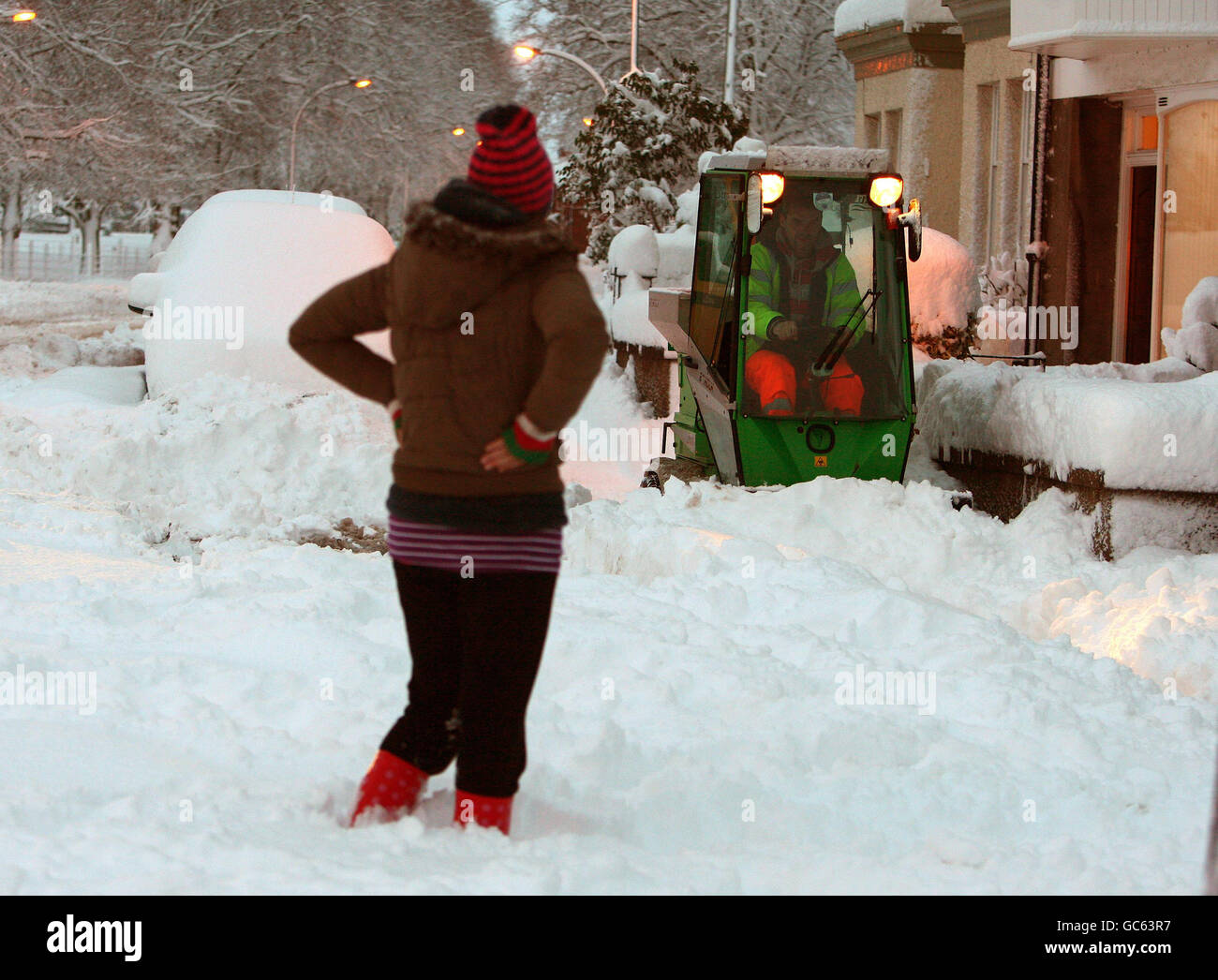 A gritting vehicle clears a footpath in St Boswells in the Scottish Borders after a night of ...