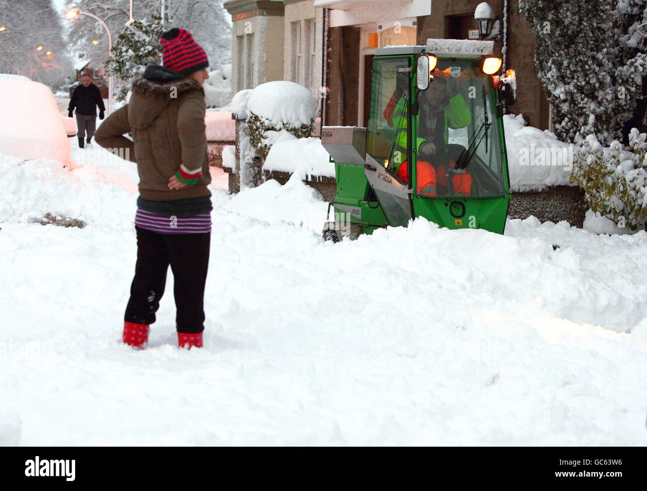A gritting vehicle clears a footpath in St Boswells in the Scottish Borders after a night of ...