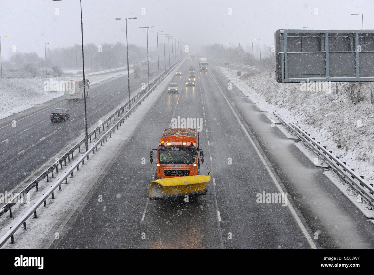 A snow plough in the snow on the M1 at Junction 16, Northamptonshire ...
