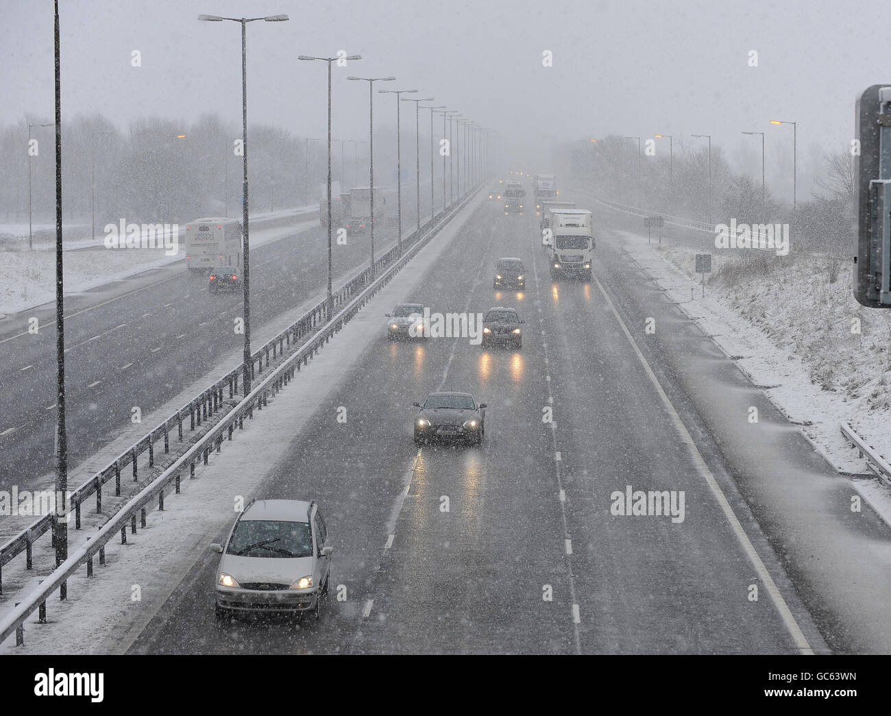 Winter weather. Cars in the snow on the M1 at Junction 16 ...