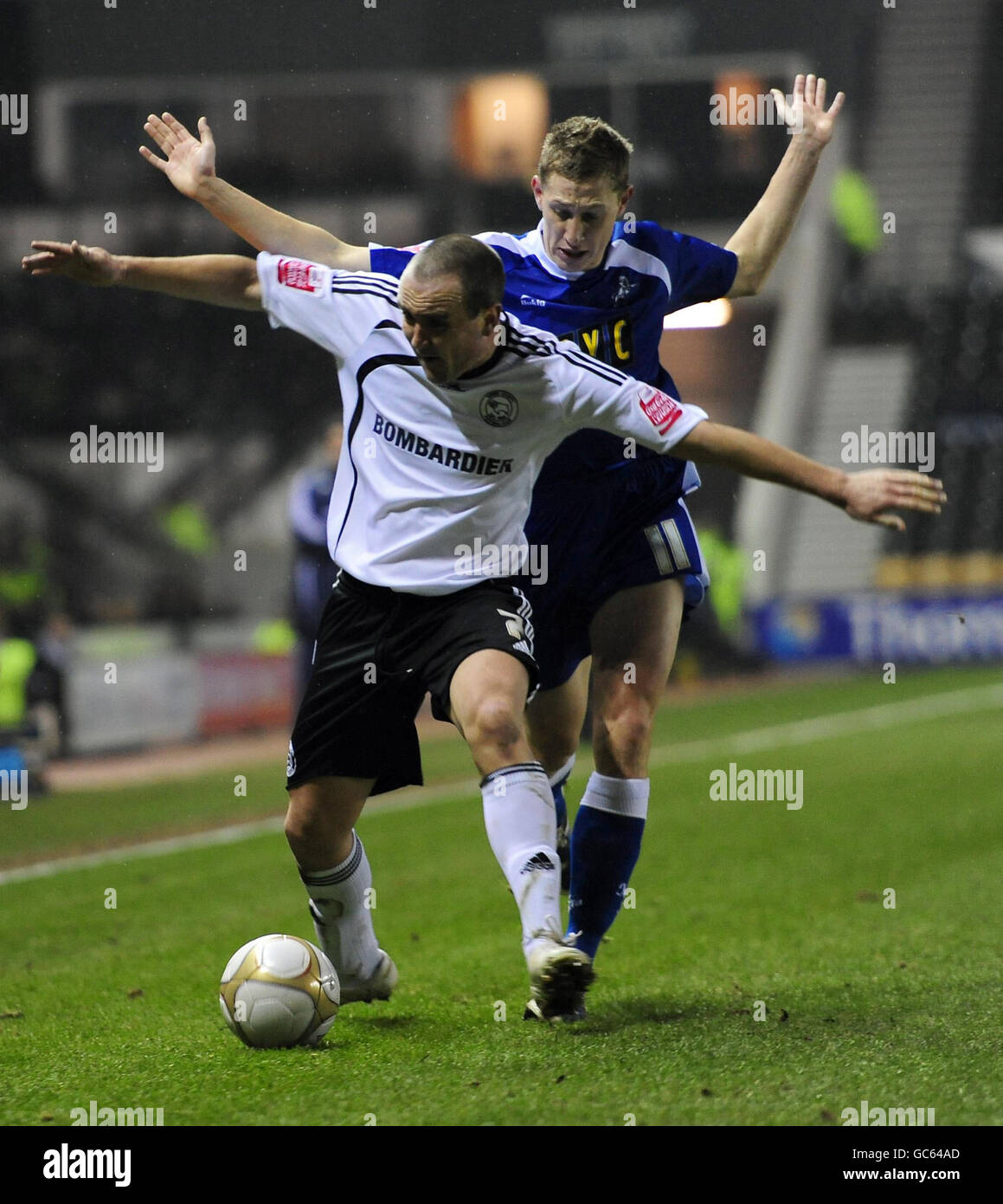 Derby County's Lee Croft holds off a challenge from Millwall's David ...