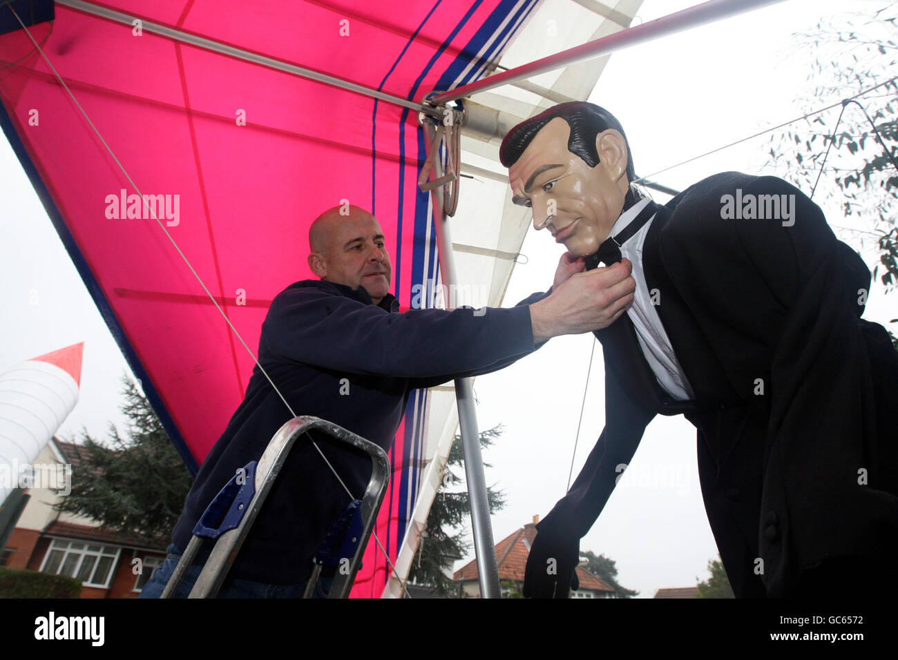 Simon Mullane adjust a bow tie on a mannequin front garden of his house ...