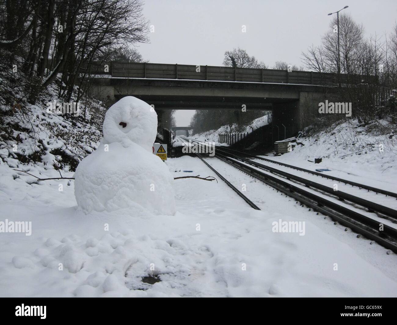 A snowman is seen on the platform at West Malling station in Kent, as ...
