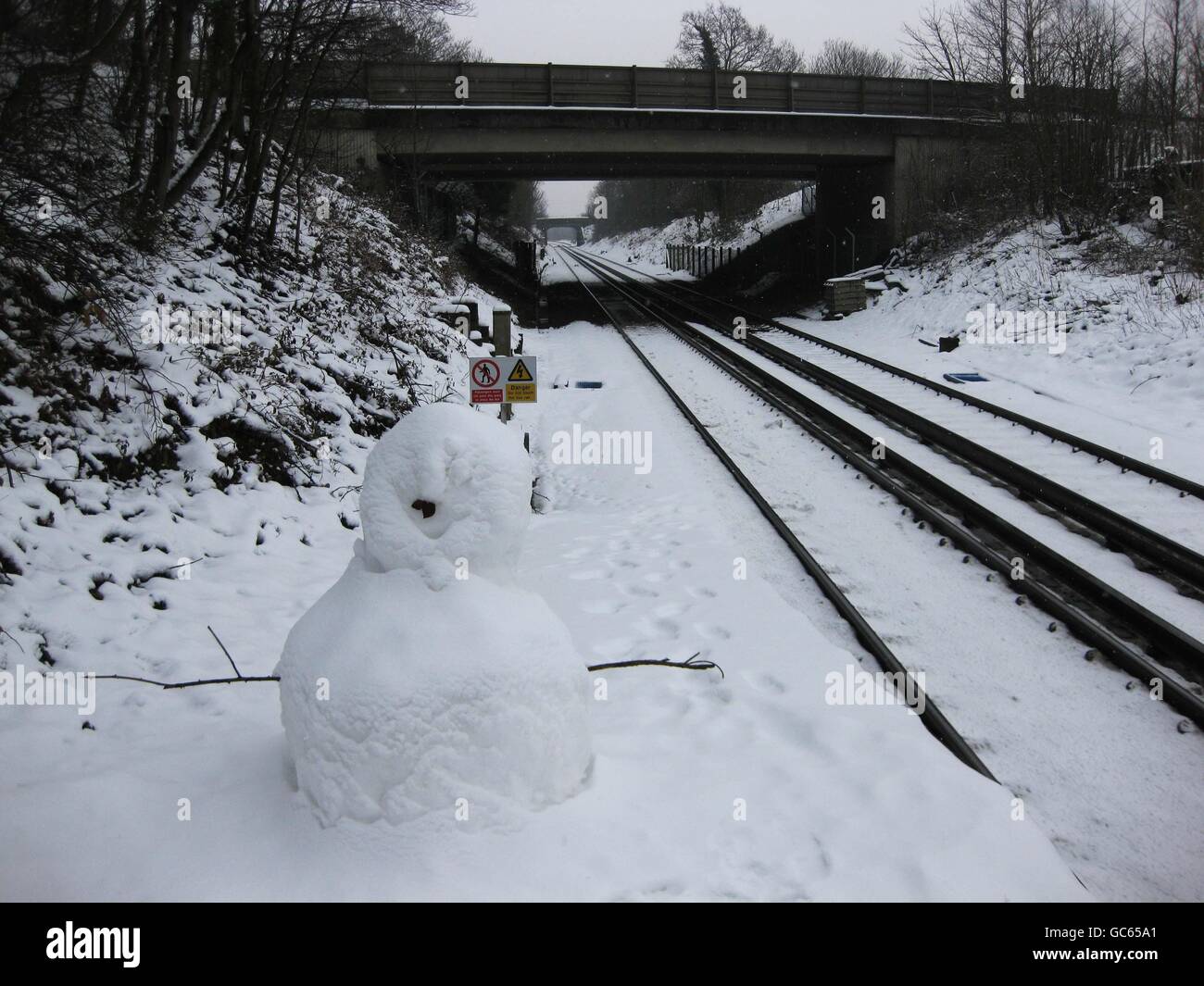 A snowman is seen on the platform at West Malling station in Kent, as ...