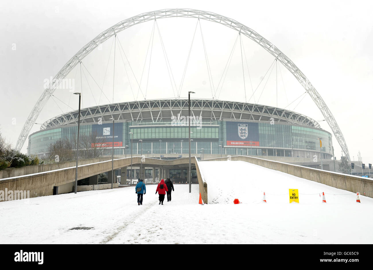 Members public walk down wembley way towards snowy wembley stadium hi ...
