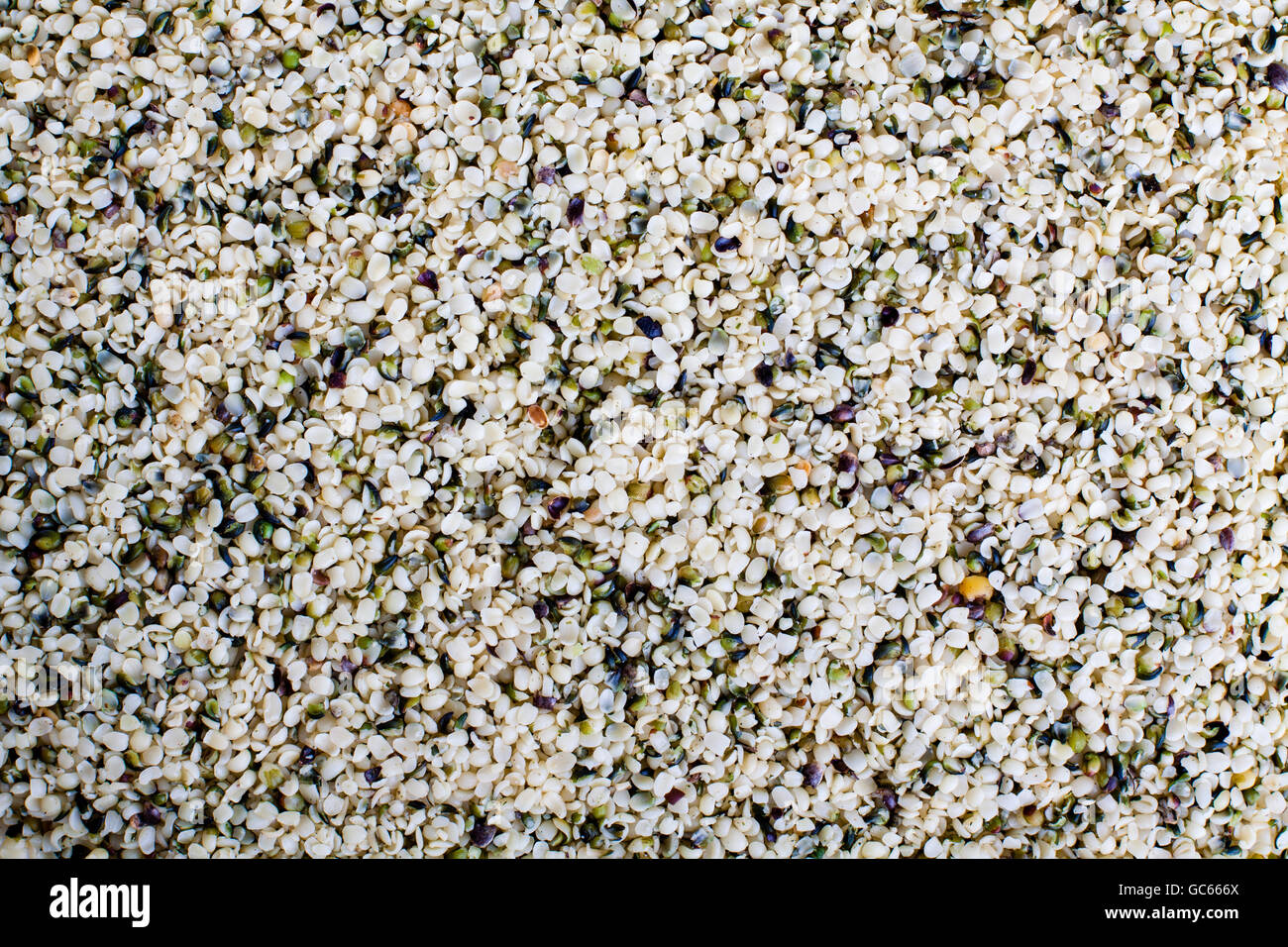 Hulled hemp background. Wallpaper of hemp seeds Stock Photo - Alamy