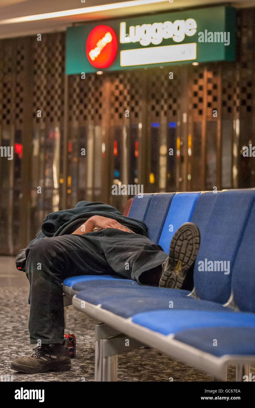 An unidentified homeless man sleeping overnight at Gatwick Airport ...