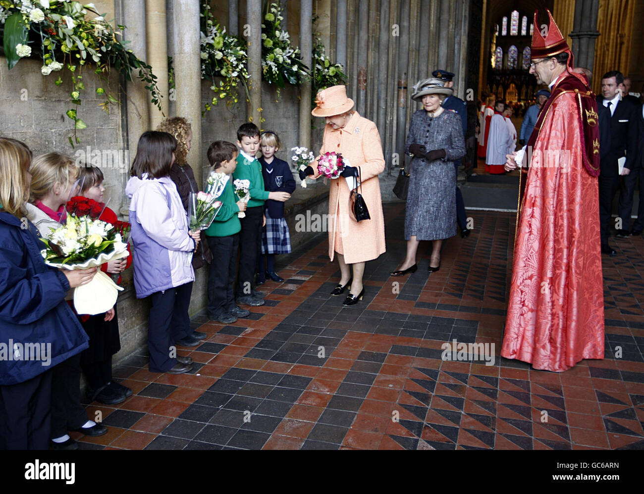 Britain's Queen Elizabeth II meets local school children during a visit ...