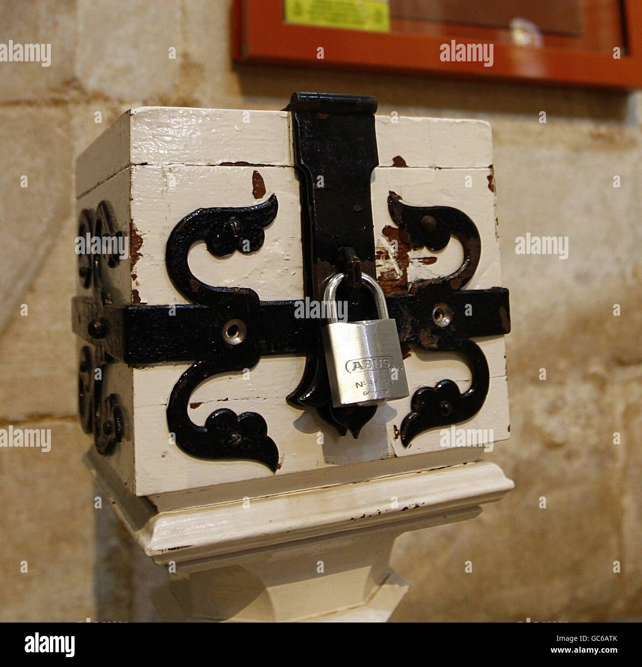 Queen visits Cambridgeshire. A locked collection box at Ely Cathedral ...