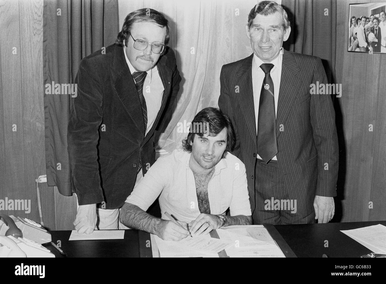 50,000 to Fulham. Watching is Fulham's Secretary George Noyce (left ...