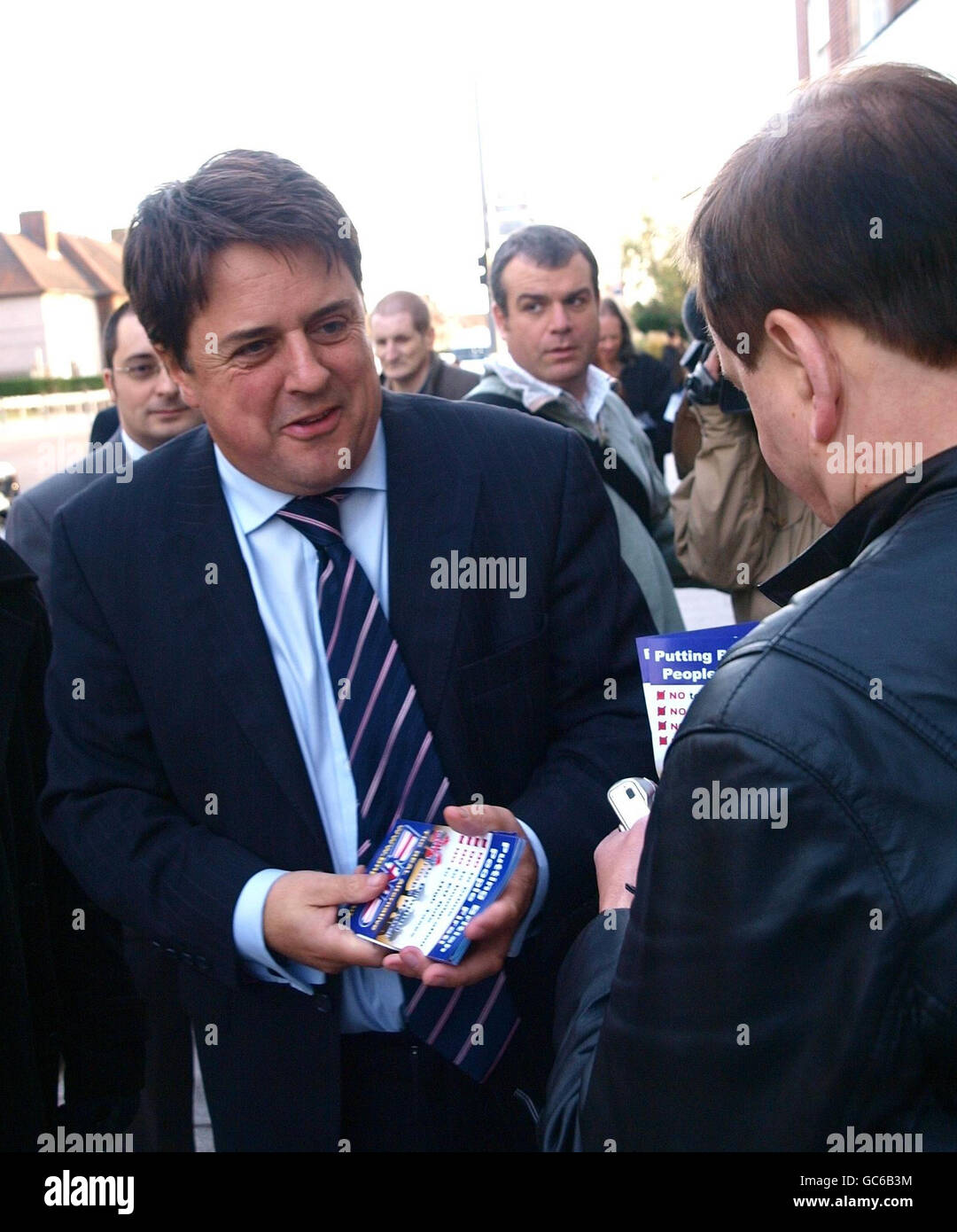 The leader of the BNP Nick Griffin is greeted by a passerby as he ...