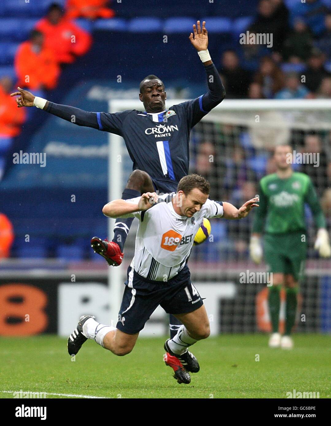 Blackburn Rovers' Christopher Samba (background) and Bolton Wanderers ...