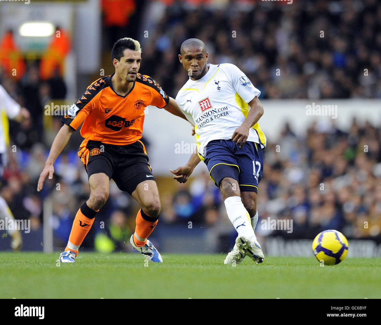 Wigan Athletic's Paul Scharner challenges Tottenham Hotspur's Wilson ...