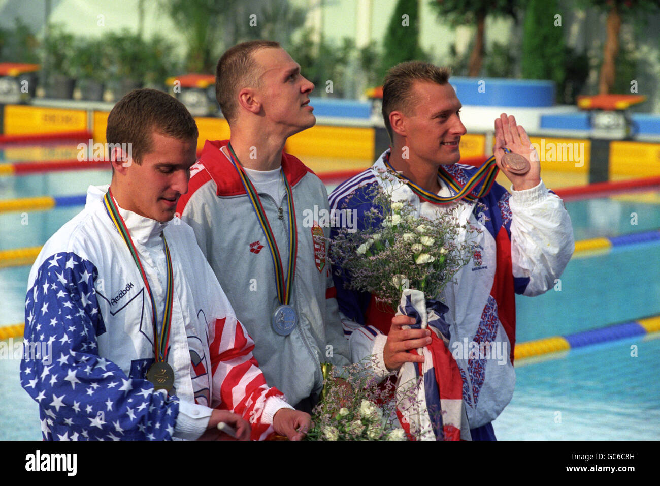 The men's 200 metre breaststroke medalist celebrate on the podium. (l-r ...