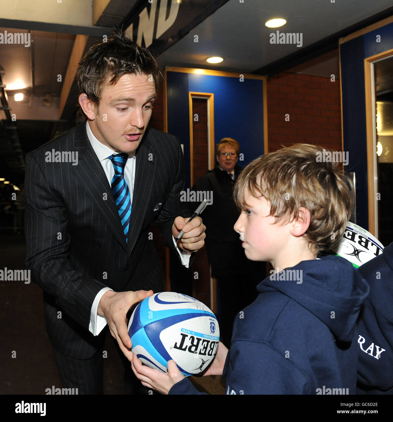 Scotland's Rory Lawson signs autographs for fans after the match Stock ...