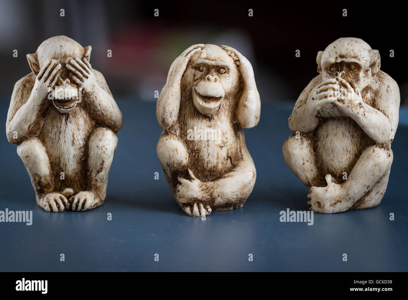close up of hand small statues with the concept of see no evil, hear no ...