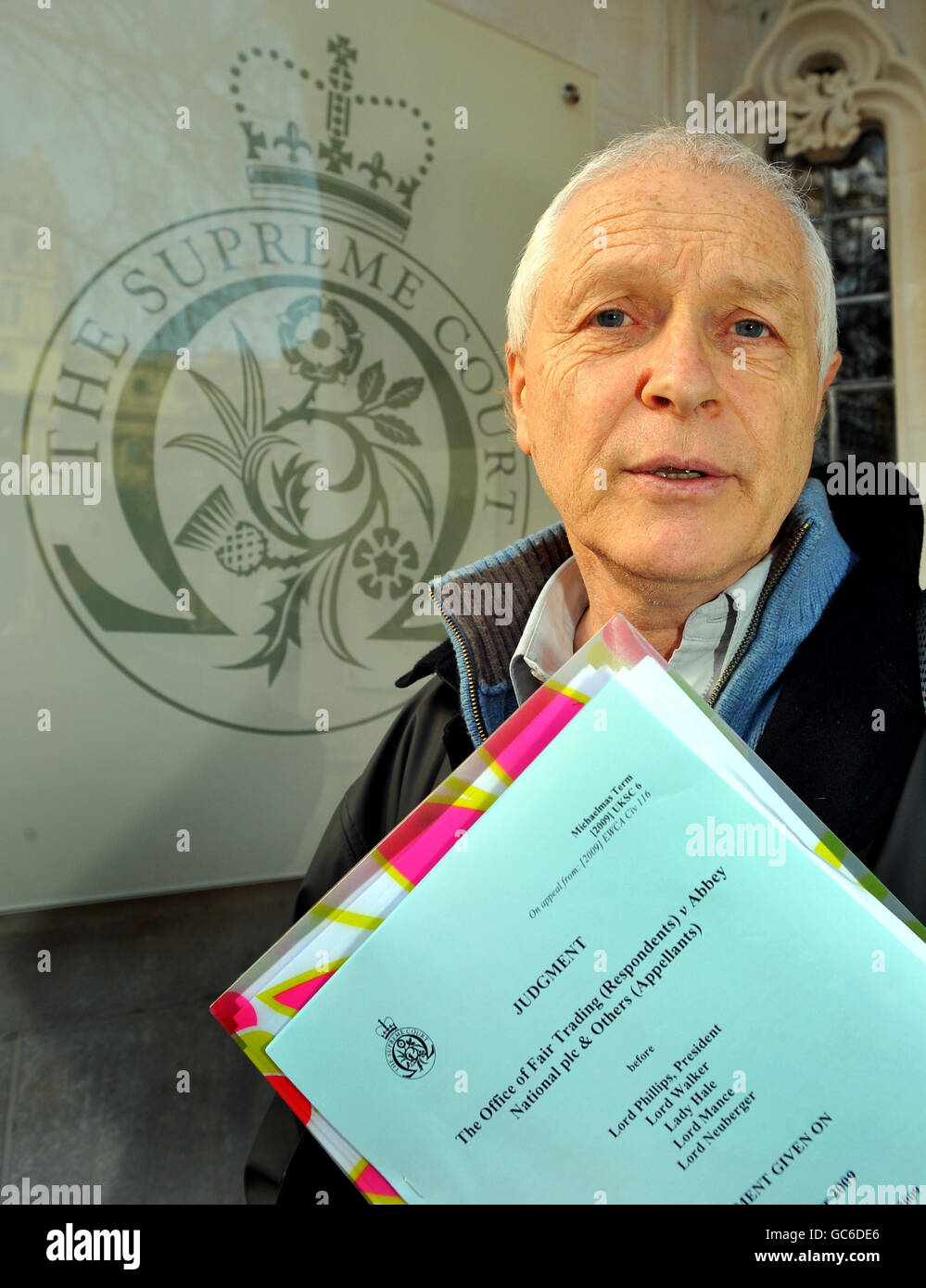 Mark Gander a member of the Consumer action Group with a copy of the ...