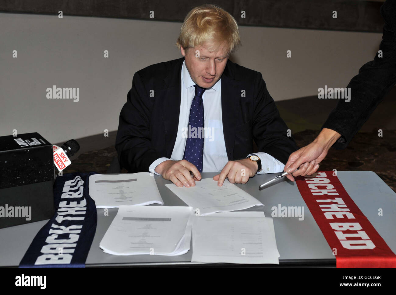 London Mayor Boris Johnson, signing the official host city agreement ...