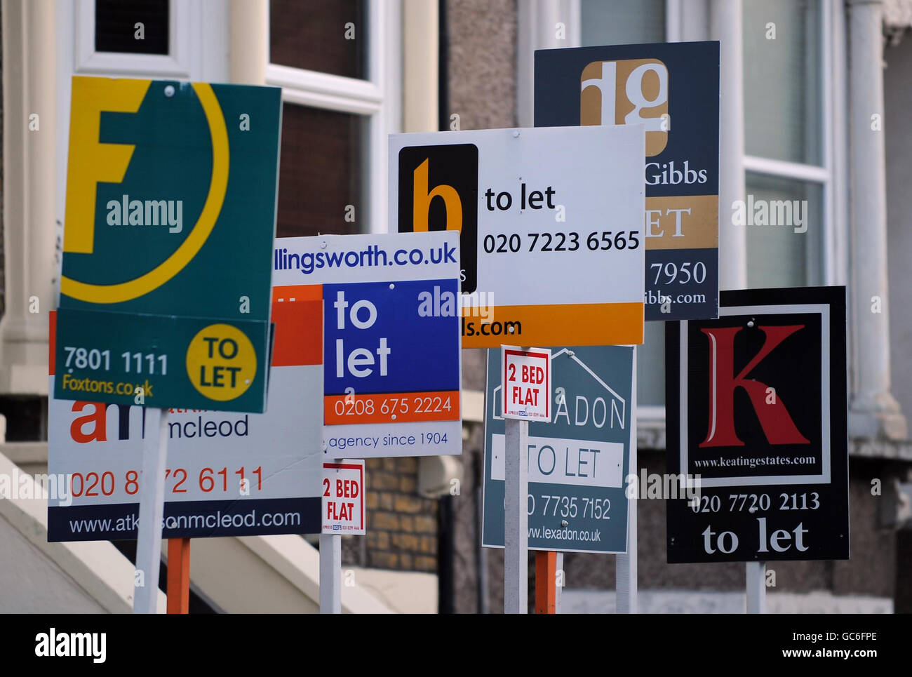 House prices. Estate agents boards are seen in Lambeth, London Stock ...