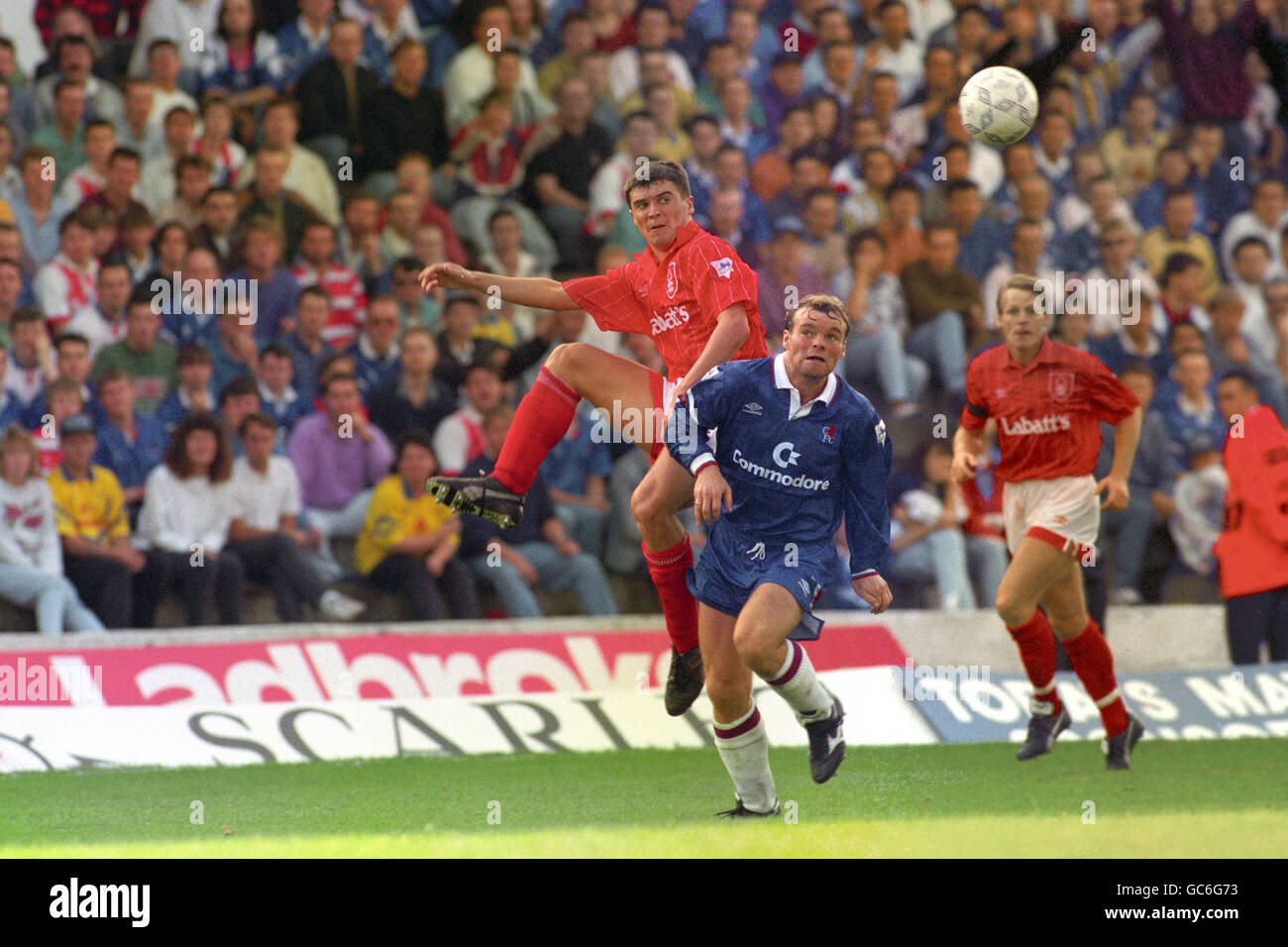 CHELSEA'S ROBERT FLECK HEADS THE BALL AWAY FROM NOTTINGHAM FOREST'S ROY ...