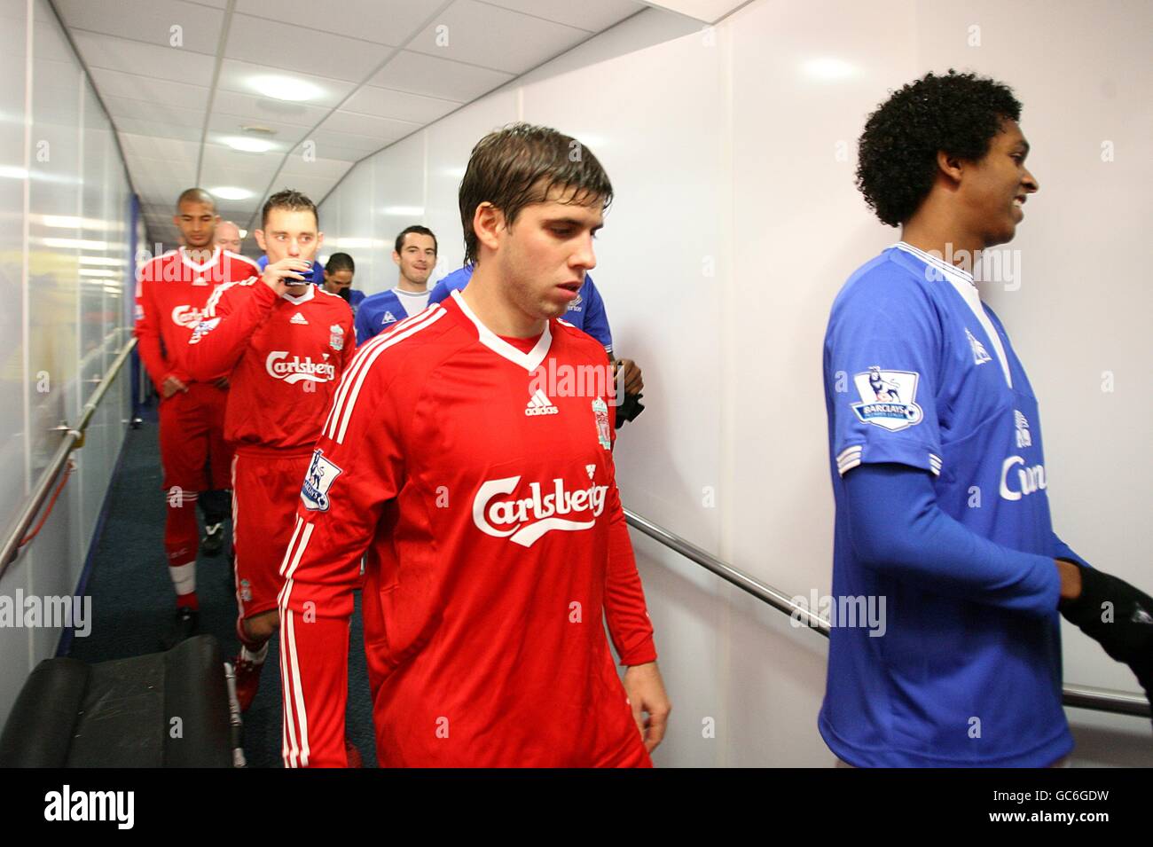 Liverpool's Emiliano Insua (center) and Everton's Joao Alves Jo (right ...