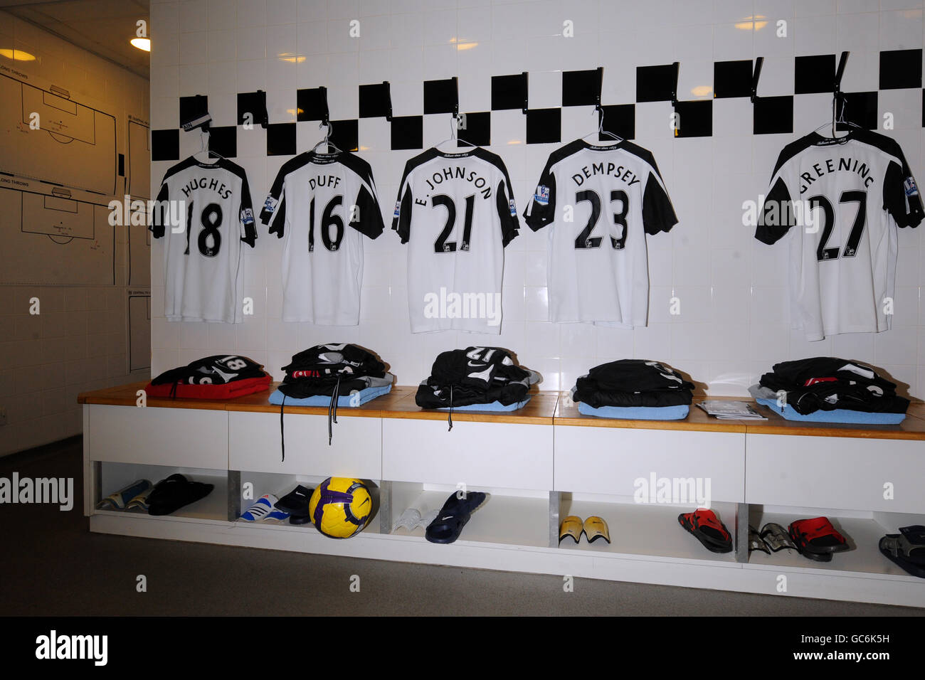 Fulham football shirts hang in the changing room hi-res stock ...