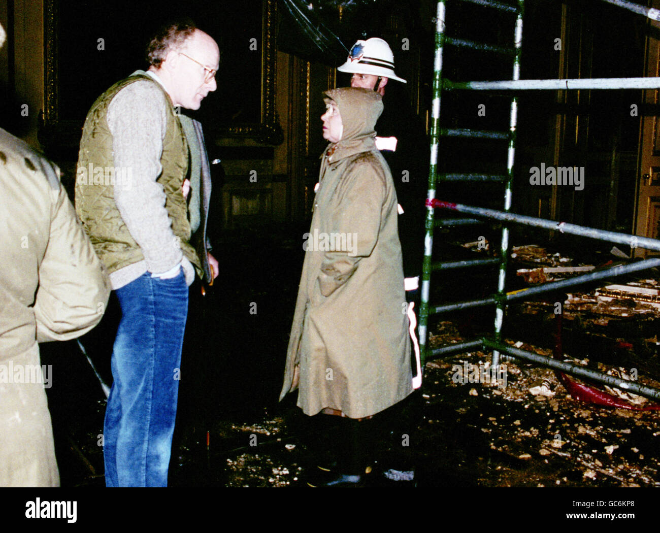 Queen Elizabeth II inspects the ruins of Windsor Castle following the ...