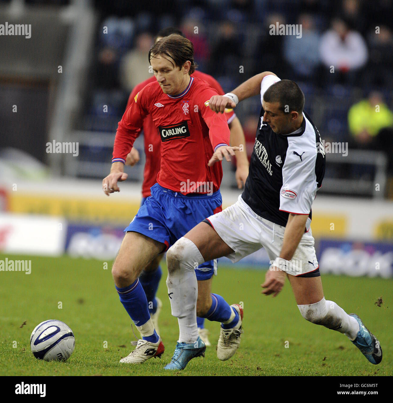 Rangers' Sasa Papac and Falkirk's Pedro Moutinho (right) battle for the ...