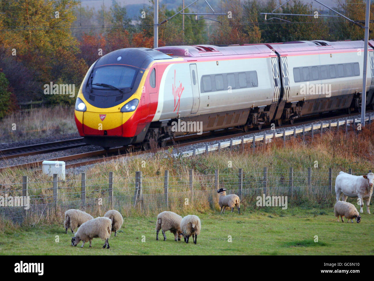 A Virgin train travels alongside the West Coast mainline close to ...