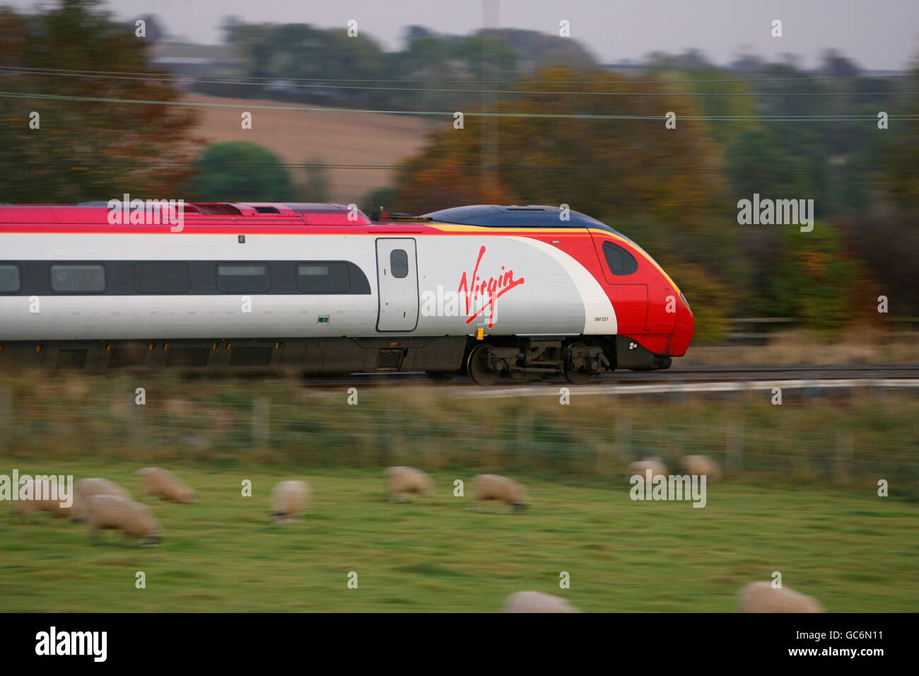 Virgin trains. A Virgin train travels alongside the West Coast mainline ...