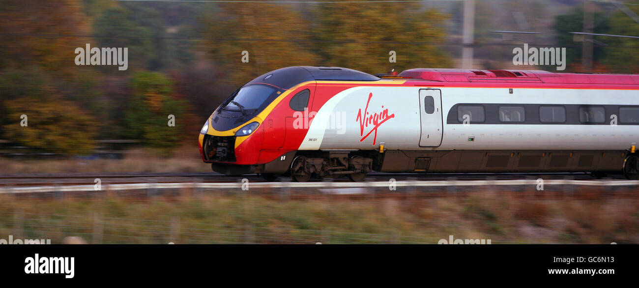 Virgin trains. A Virgin train travels alongside the West Coast mainline ...