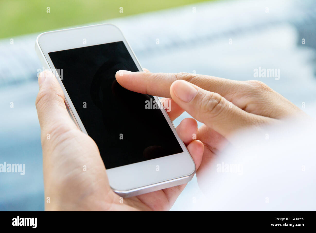 Hands of woman pointing at smartphone Stock Photo - Alamy