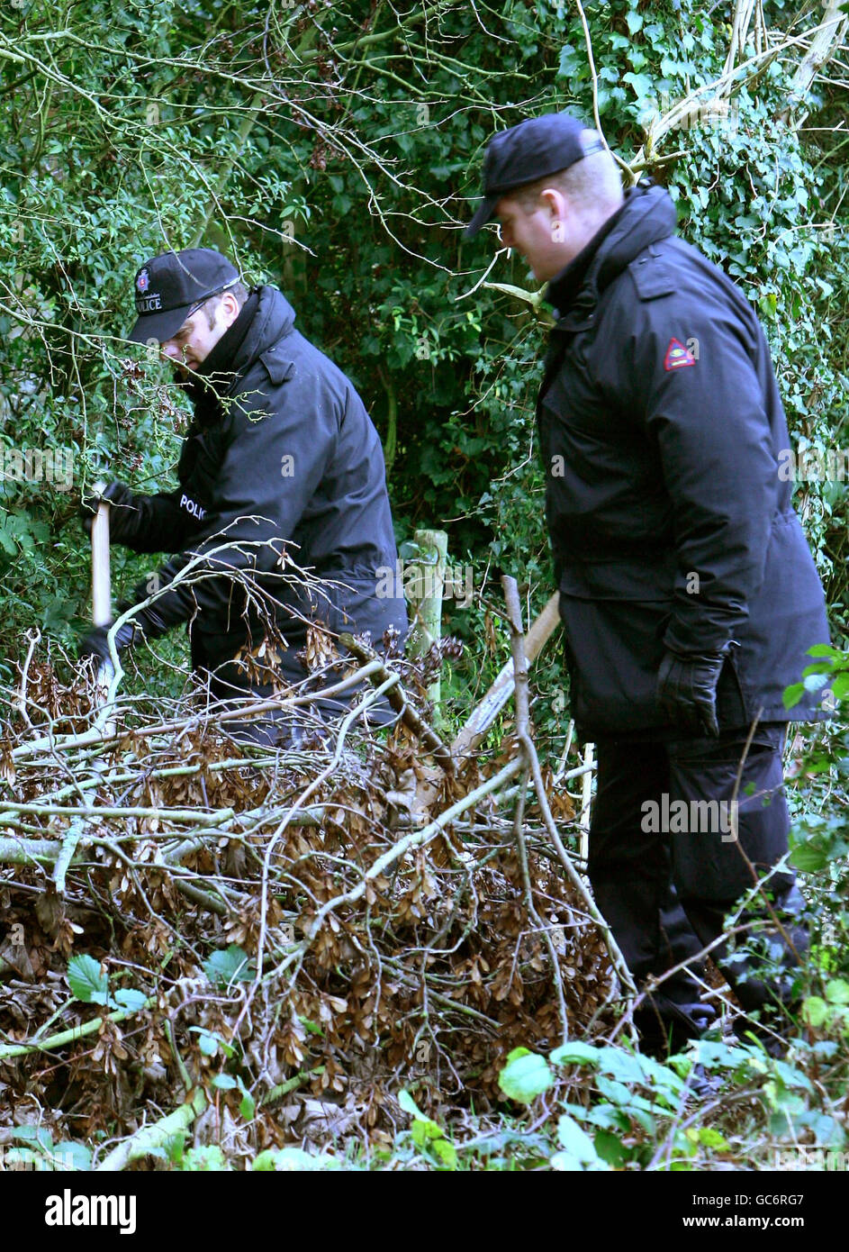 Police officers search woodland near East Sutton Park Prison in Sutton ...