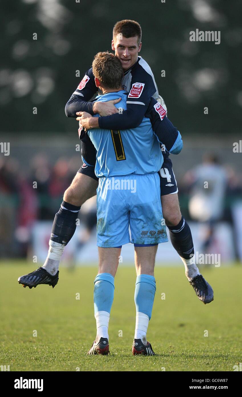 Lincoln City's Janos Kovacs (right) celebrates with goalkeeper Robert ...