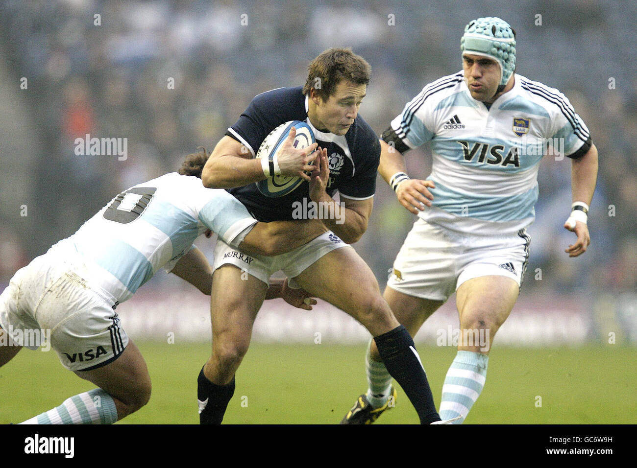 Scotland's Alex Grove (centre) tackled by Argentina's Santiago ...