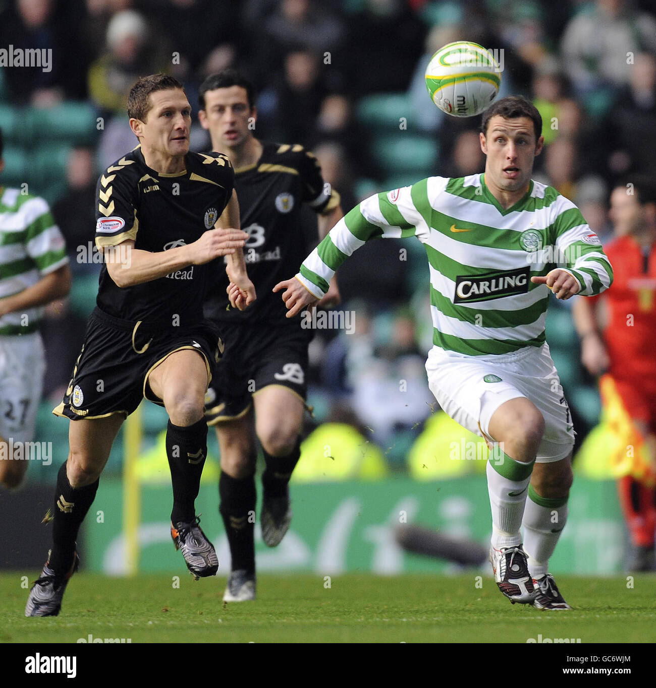 Celtic's Scott McDonald and St Mirrens's Hugh Murray battle for the ...