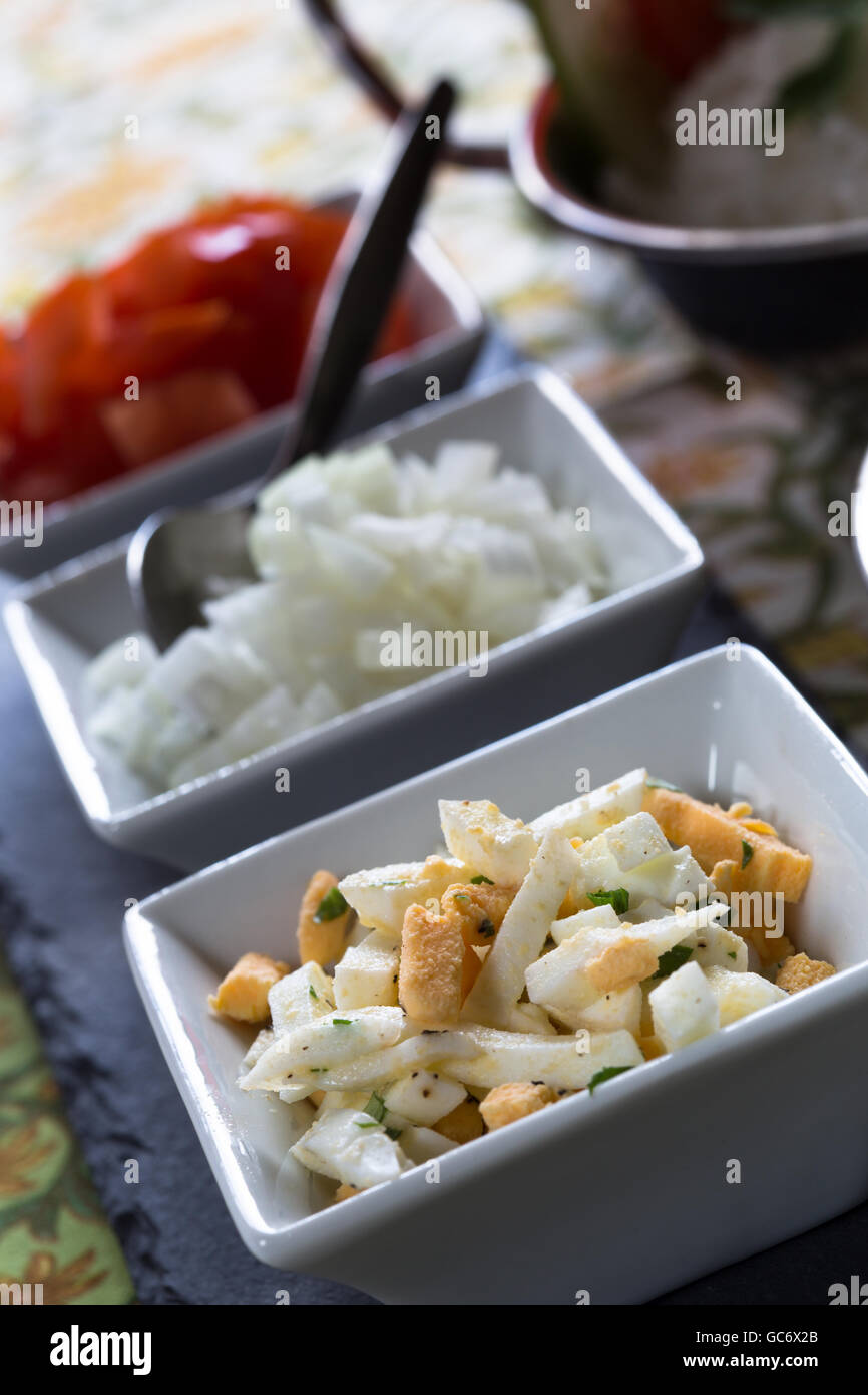 A close-up of a selection of condiments served with an Asian meal to ...