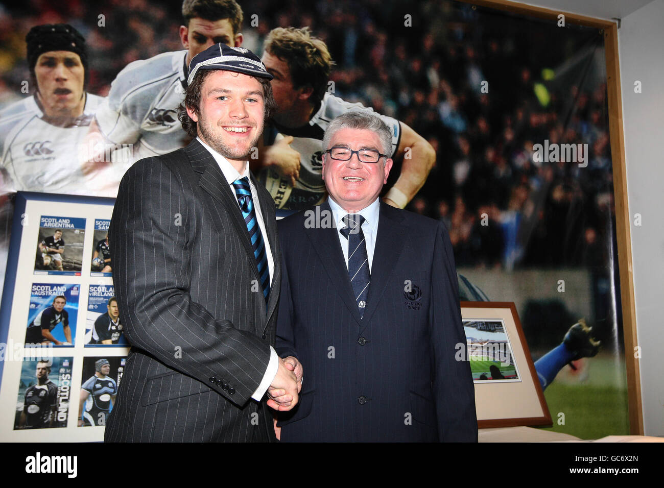 Scotland Rugby president Jim Stevenson presents Alan MacDonald with a ...